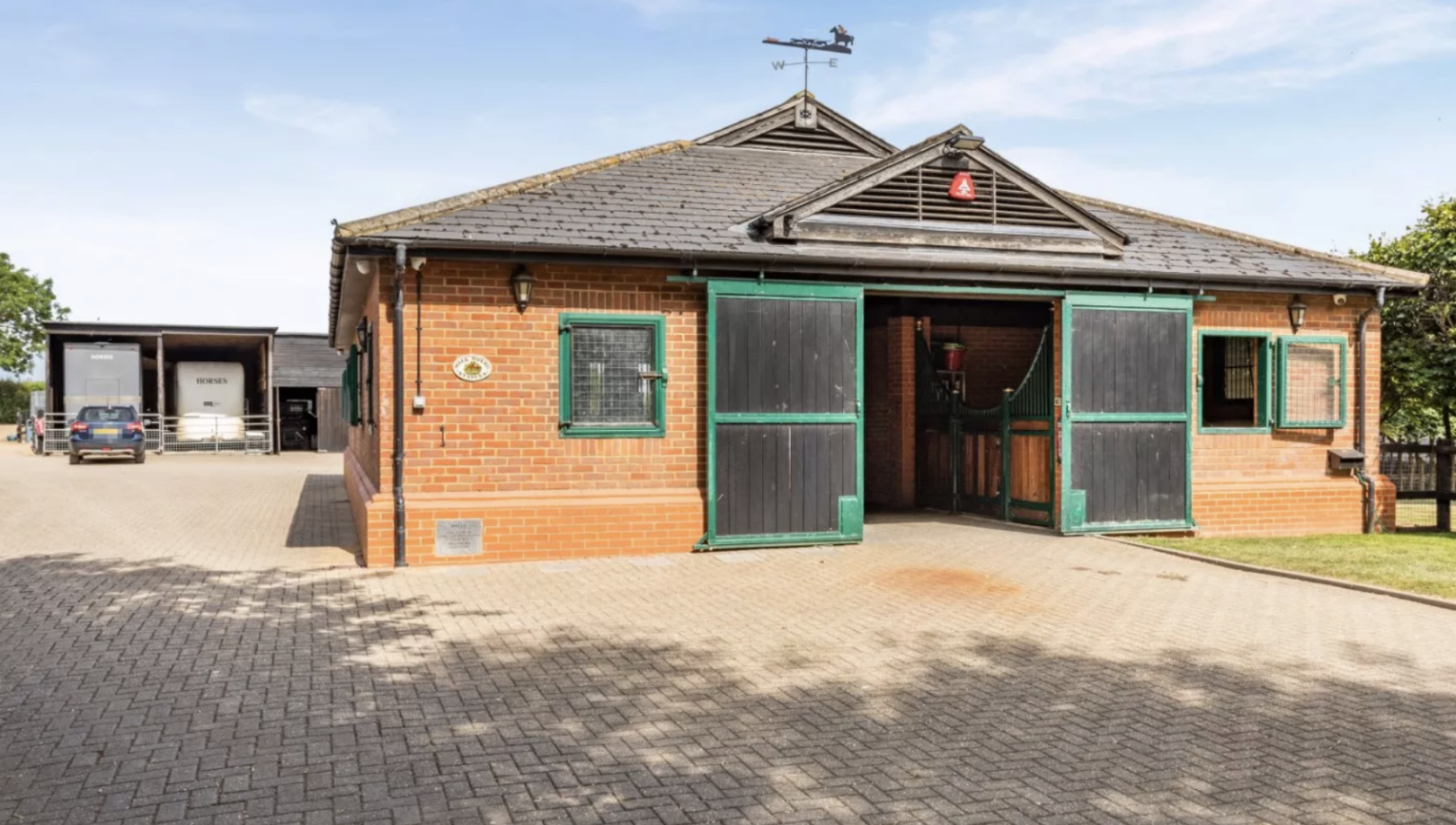 A country home with stabling, arena, horsewalker, and pool set in 23 acres