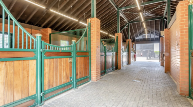 A country home with stabling, arena, horsewalker, and pool set in 23 acres