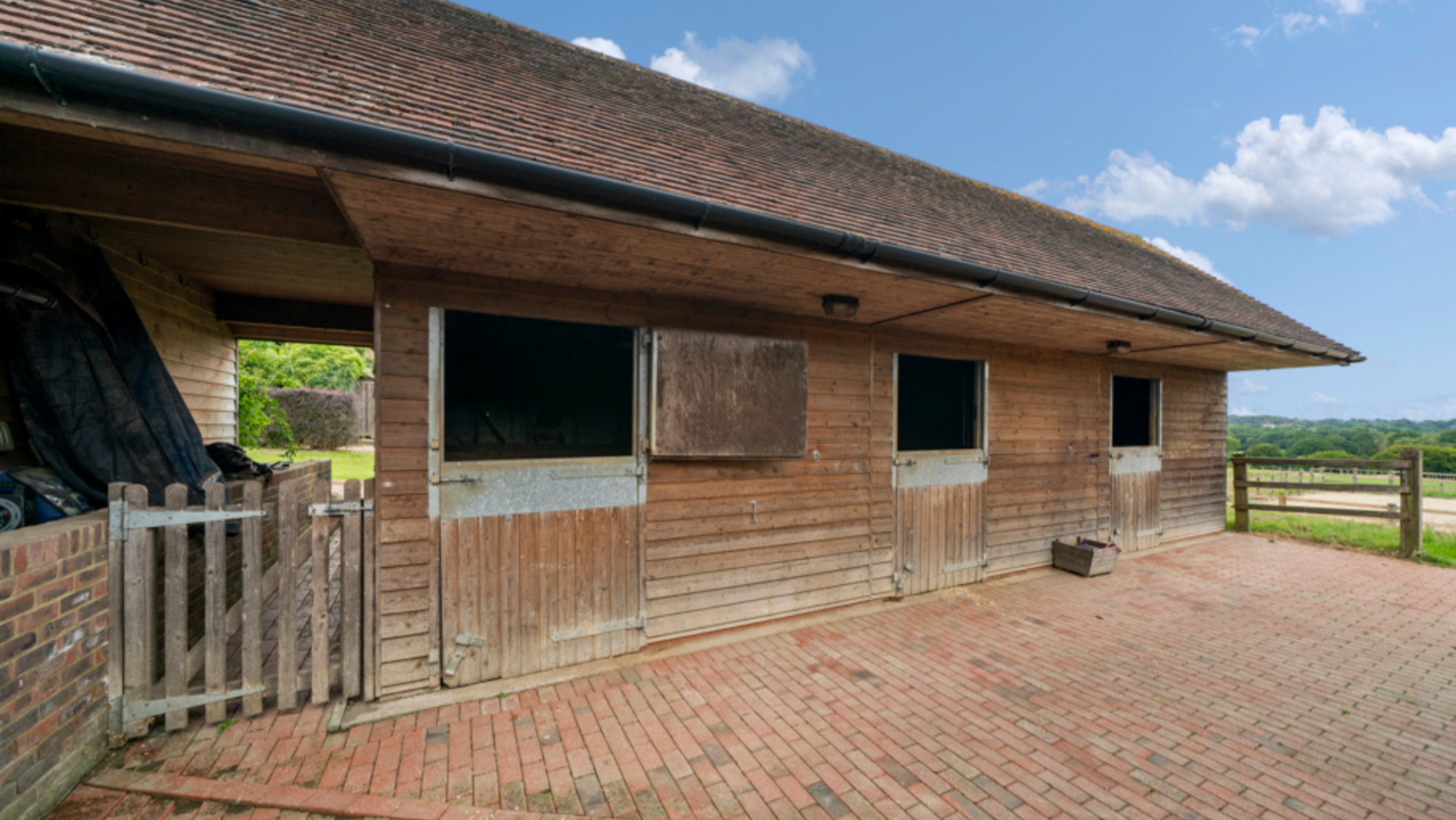 Horsey home with 18 acres, stables, an arena and an oast house annex
