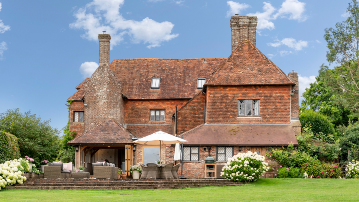 Horsey home with 18 acres, stables, an arena and an oast house annex