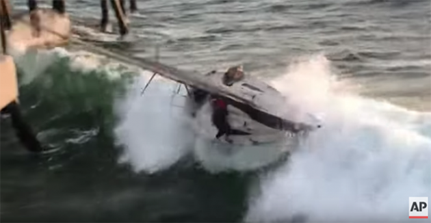 Video: Four rescued after boat smashes into a pier, breaking in half - YBW