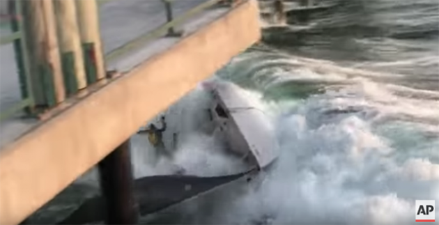 Video: Four rescued after boat smashes into a pier, breaking in half - YBW